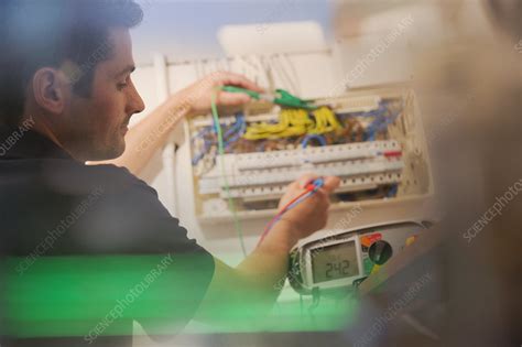 Electrician Testing Fuse Box With Voltmeter Stock Image F Science Photo Library