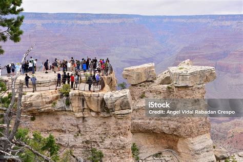 Tourists Overlook The Grand Canyon From Mather Point Tourist Stop In The South Rim Of The Grand
