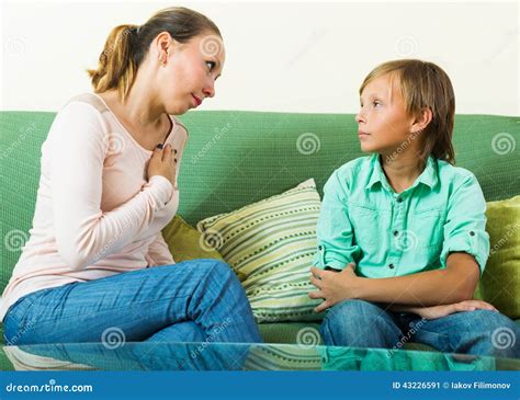 Mother With Teenager Son Having Serious Conversation Stock Image