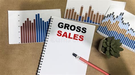 Concept Of Gold Sales Write On Book Isolated On Wooden Table Stock Image Image Of Note