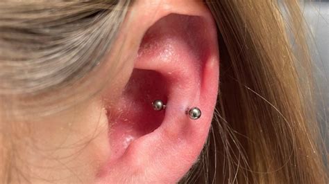 Everything You Need To Know Before Getting A Snug Piercing
