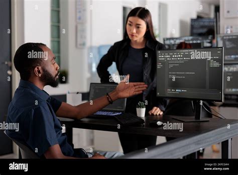 diverse team of software developer developing html code and cloud