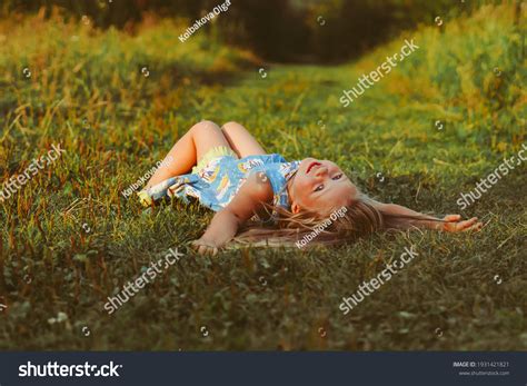 Girl Laying In Grass