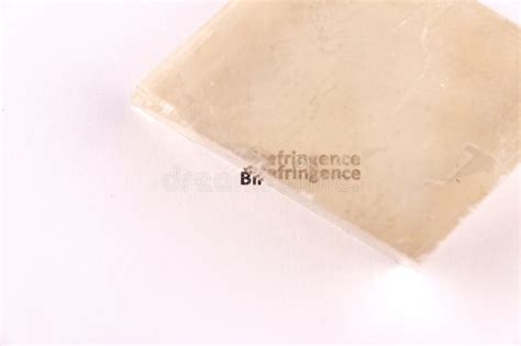 Optical Birefringence Demonstrated Using A Text Using A Natural Double