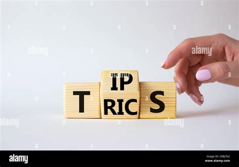 Tips And Tricks Symbol Businessman Hand Points At Wooden Cubes With