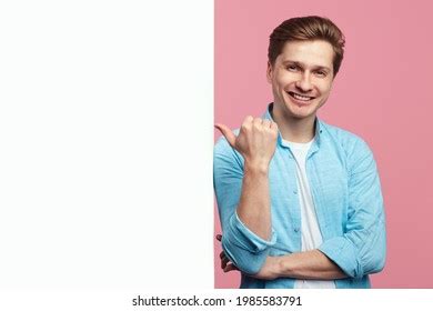 Man Pointing Empty White Billboard Wall Stock Photo 1985583791 Shutterstock