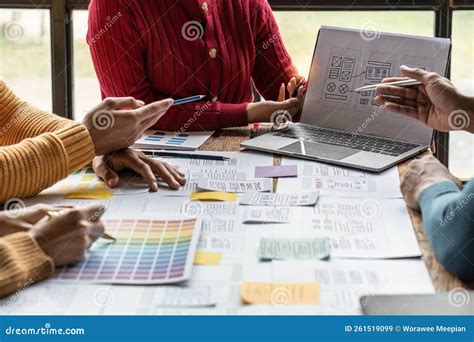 Group Of Ux Developer And Ui Designer Brainstorming About App Interface Design At Modern Office