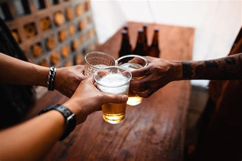 Premium Photo Toasting Beer Glasses In Bar
