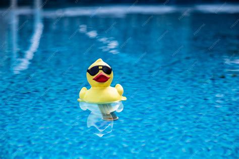 Premium Photo Funny Rubber Duck Floating In A Pool