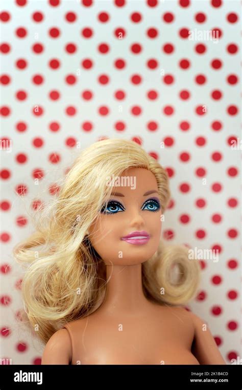 Blonde Barbie Doll Face Against A Polka Dot Background Stock Photo Alamy