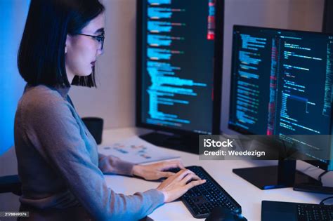 asian woman software development working on coding computer screen and