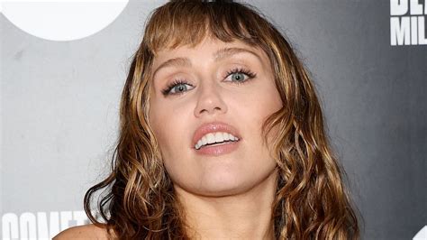 Miley Cyrus Flashes A New Very Faint Tattoo On Her Chest As She Goes