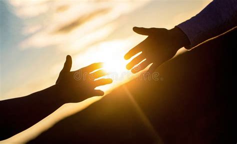 Giving A Helping Hand Rescue Helping Gesture Or Hands Friendly Handshake Friends Greeting