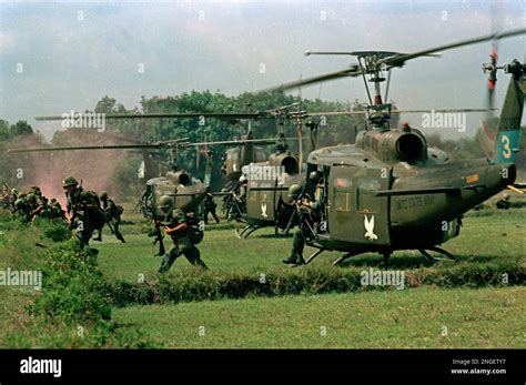 Us Paratroopers Land And Unload From A Helicopter Under Heavy Fire