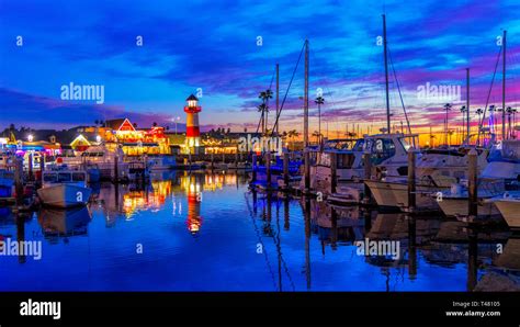 Oceanside Harbor Just After Sunset With Lighthouse And Wharf Lighted Up