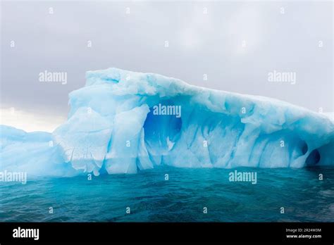 Brown Bluff Antarctica An Iceberg Juts Out Of The Sea In The