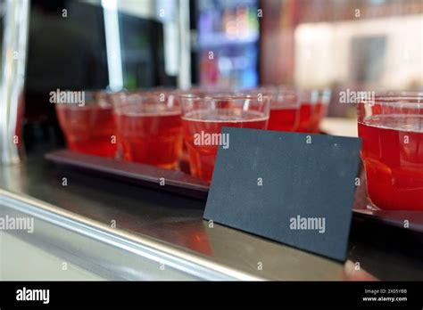 Colorful Array Of Fruit Juice Cups On A Serving Cart In A Cafeteria