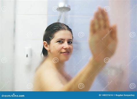 Young Happy Woman Taking Hot Shower At Home Or Hotel Bathroom