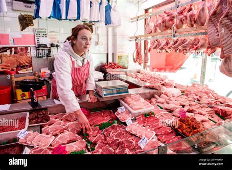 Woman Butcher Shop Happy Female Butcher Holding Large Ham Photos By Canva