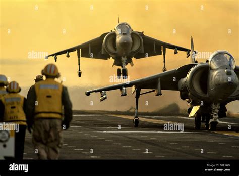 A Us Marine Corps Av 8b Harrier Fighter Aircraft Performs A Vertical