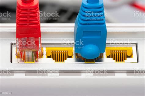 Modem Router Network Hub With Cable Connecting Bright Blue And Red Cables And Connectors Stock