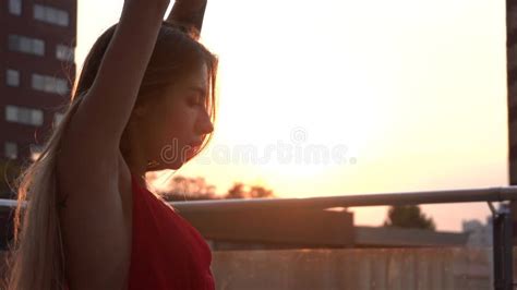 Beautiful Young Girl Dancing On The Street Of A Modern City In The