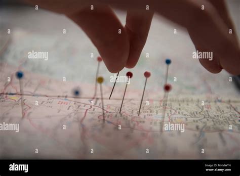 Woman Applying Pins On Map Stock Photo Alamy