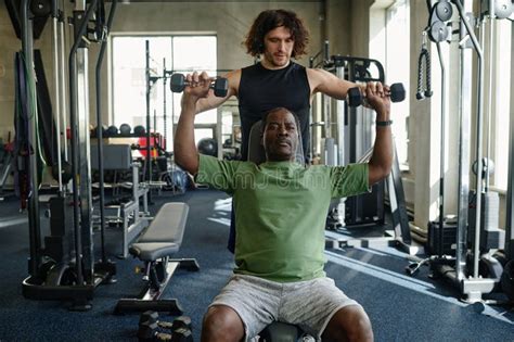 Man Lifting Weight At Gym Stock Image Image Of Guidance 299443599