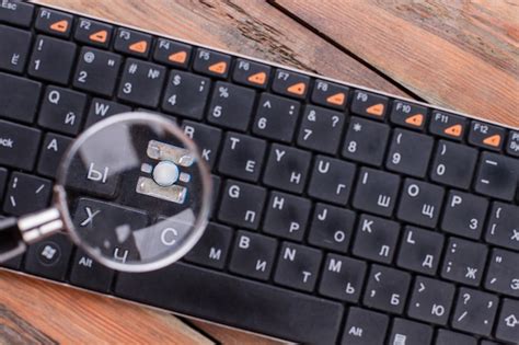 Premium Photo Magnifying Glass Over Black Keyboard