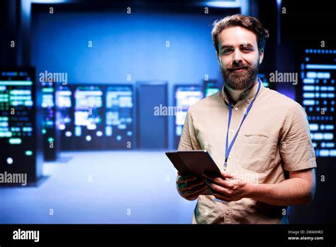 Portrait Of Technician Making Sure Servers In Cloud Computing Business Service Are Correctly