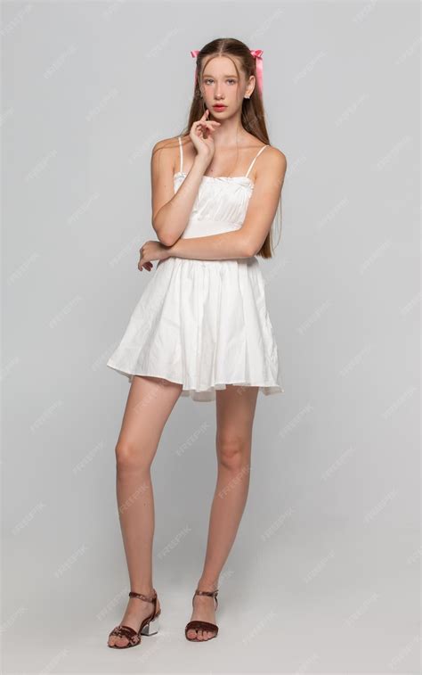 Beautiful Romantic Young Girl In A White Short Dress Posing In The