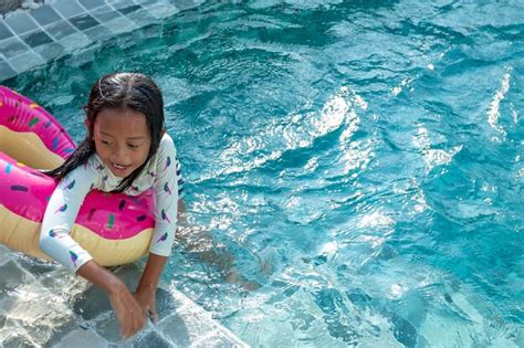 Premium Photo High Angle View Of Girl With Inflatable Raft In