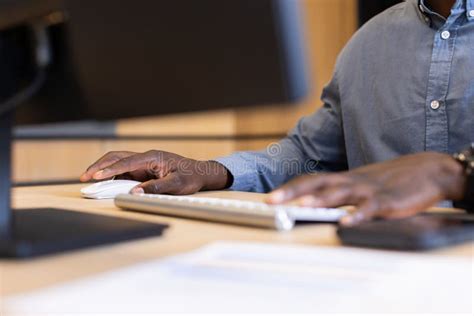 Using Computer Mouse And Keyboard Person Working In Modern Office