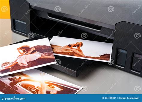 Modern Laser Printer Printing Color Photos Of Women Close Up Stock