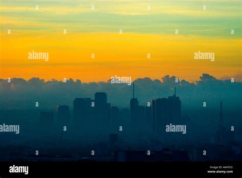 The Skyline Of Makati City Manila At Sunrise Shrouded In Mist And Fog
