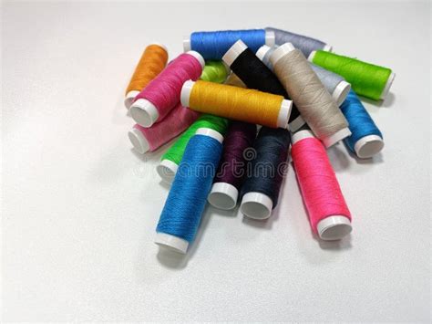 Scattered Colorful Sewing Thread Spools On White Background Stock Image