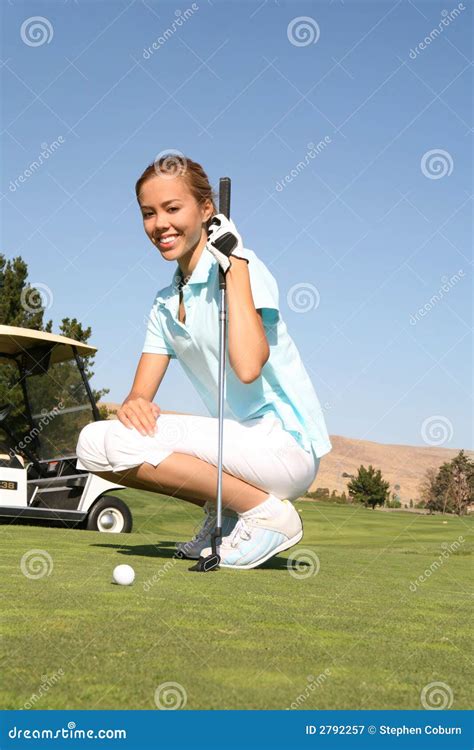 Woman Golfer Hitting The Ball On The Background Scenery Beautiful Stock