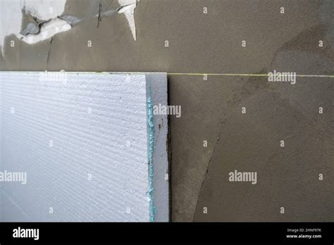 Installation Of Styrofoam Insulation Sheets On House Facade Wall For Thermal Protection Stock