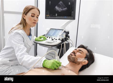 Heart Ultrasound Exam For Adult Man With Ultrasound Specialist While