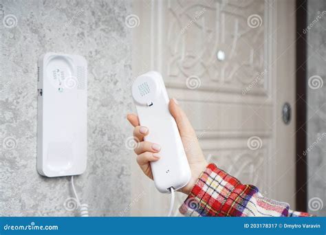 Woman Holds The Intercom Receiver In The Hand Stock Image Image Of