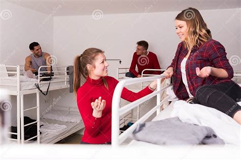 Female Travelers Discussing In Hostel Stock Image Image Of Dorm