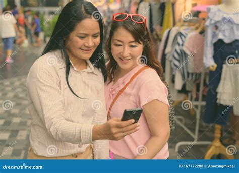 Wo Mature Asian Women Shopping Together In The Street Market Stock