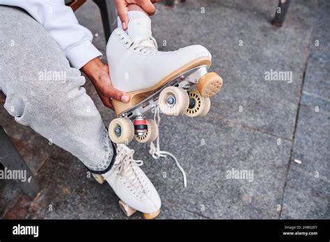 Woman Taking Off Her Roller Skates Stock Photo Alamy