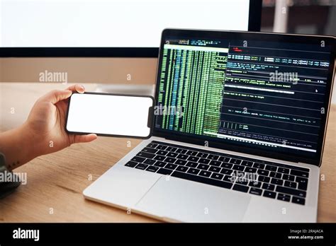 laptop coding and hands with mockup phone for website hacking
