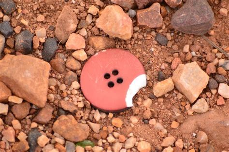 premium photo broken button on field