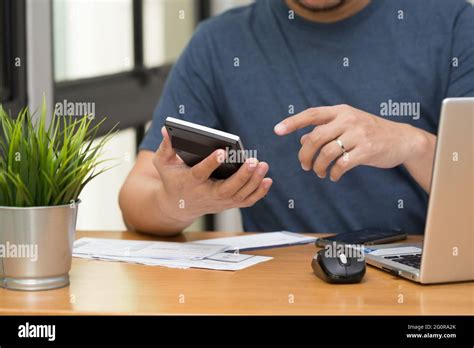 Men Calculate The Payment Balance Of Credit Card Debt And Monthly Loan Stock Photo Alamy