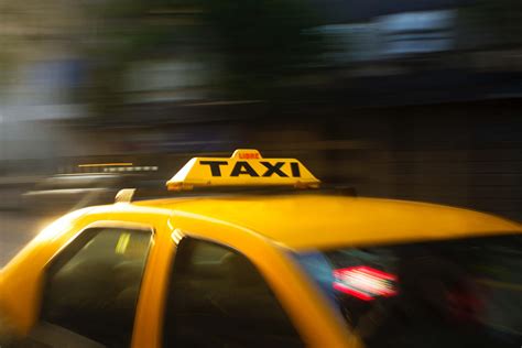 Download Iconic Yellow Cab in the City Wallpaper | Wallpapers.com