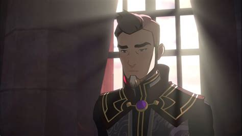 A Man Standing In Front Of A Window With His Hand On His Face