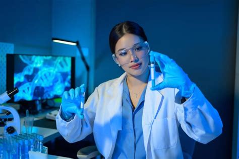 Premium Photo A Woman In A Lab Coat Holding A Test Tube