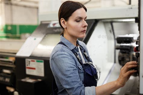 Woman Running Cnc Lathe Stock Photo By Media Photos PhotoDune
